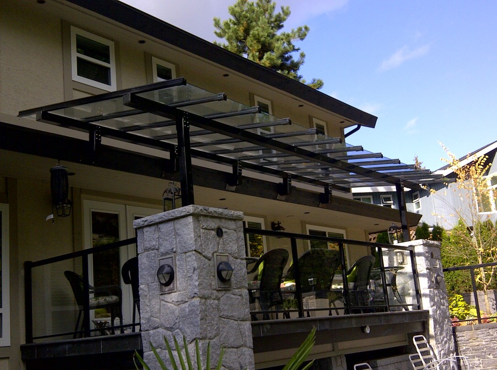 Installation of new deck canopy. Patio deck canopy system for homes.